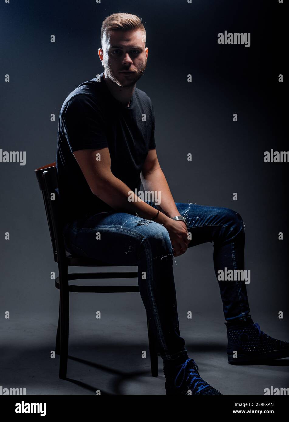 Portrait of a handsome male model posing in cool fashionable clothing ...