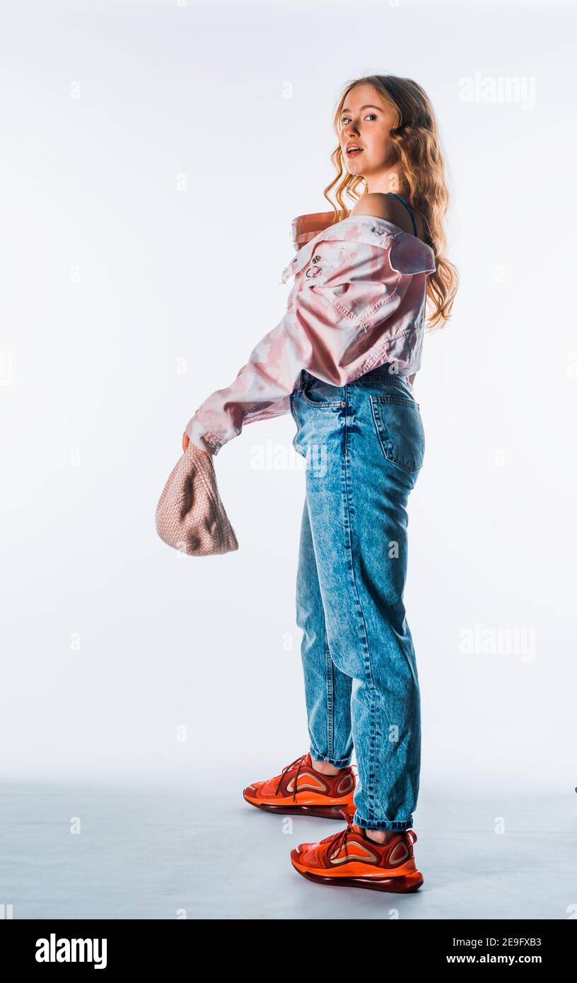Body shot of a cool young woman wearing modern style clothing Stock ...