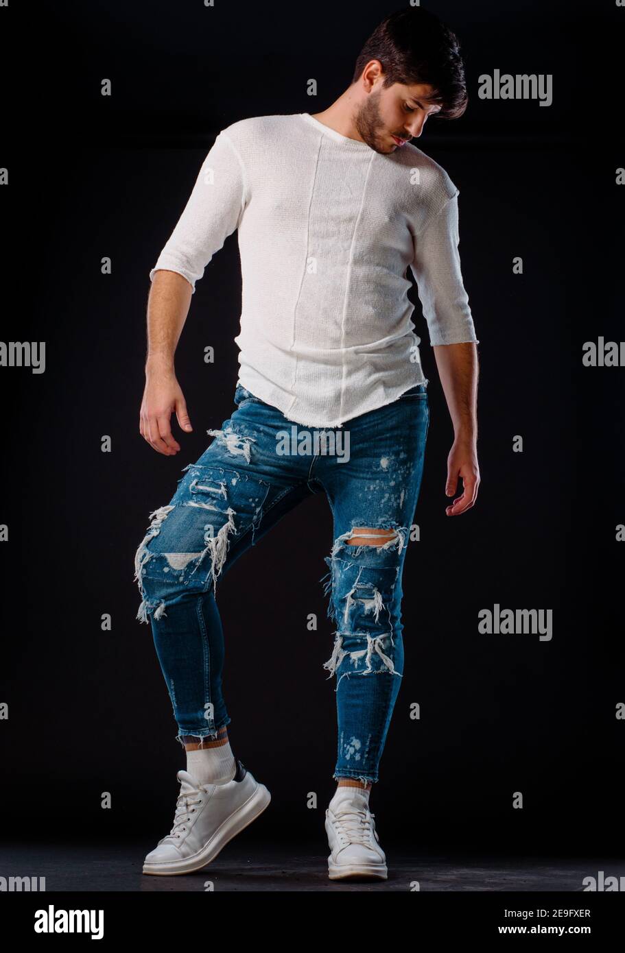 Full body shot of a trendy young man wearing modern style clothes Stock ...