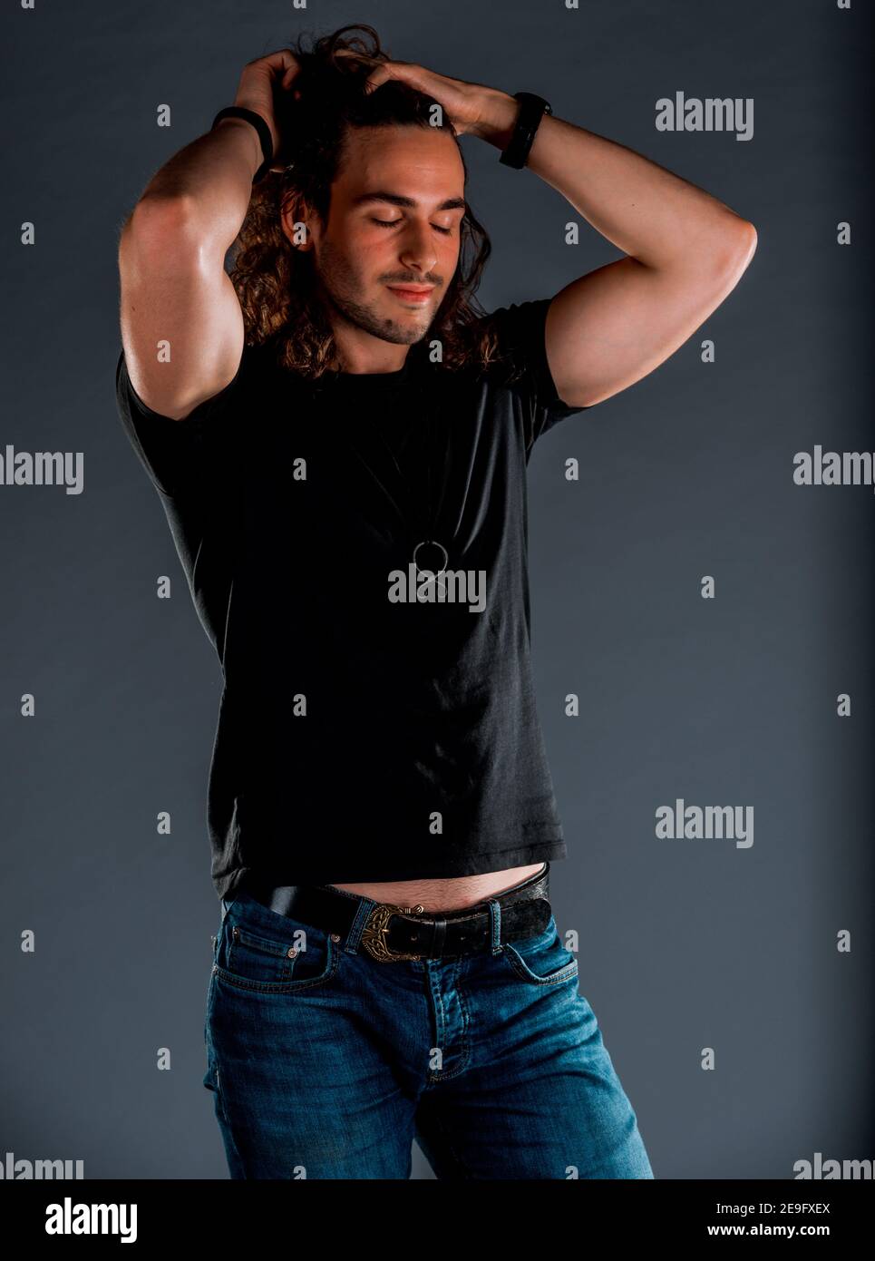 Portrait of an attractive young guy posing in modern style clothes ...