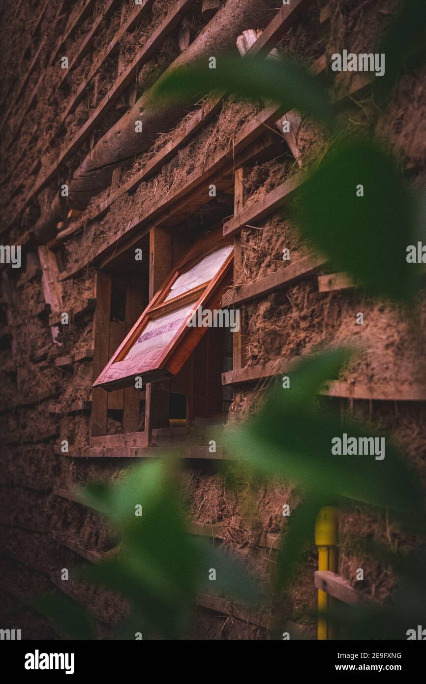Vertical shot of open wooden window frame on old grunge wall Stock ...