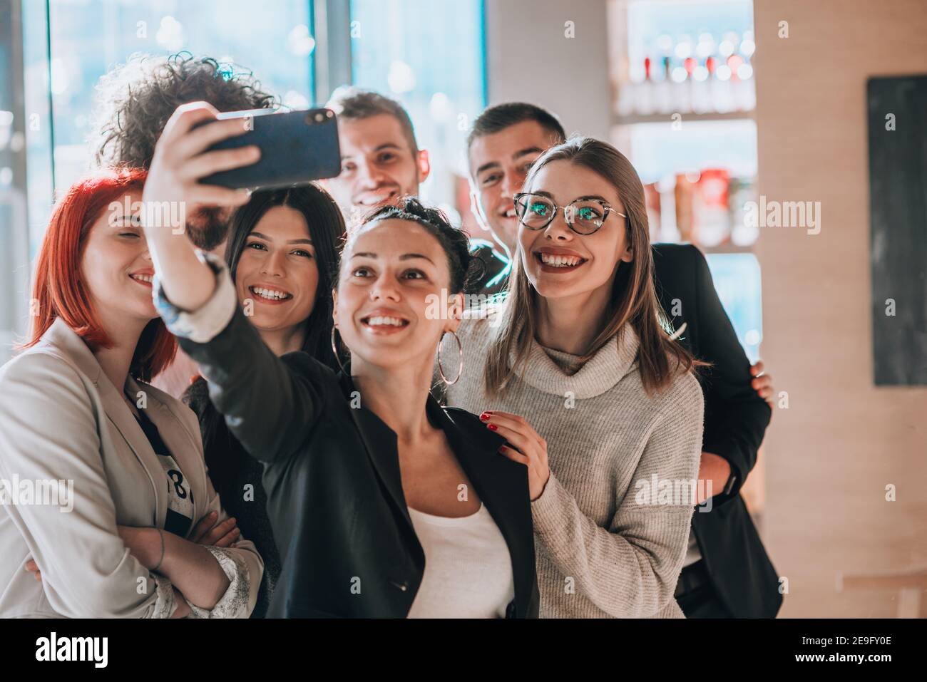 Group of women taking a selfie in a bar hi-res stock photography and ...