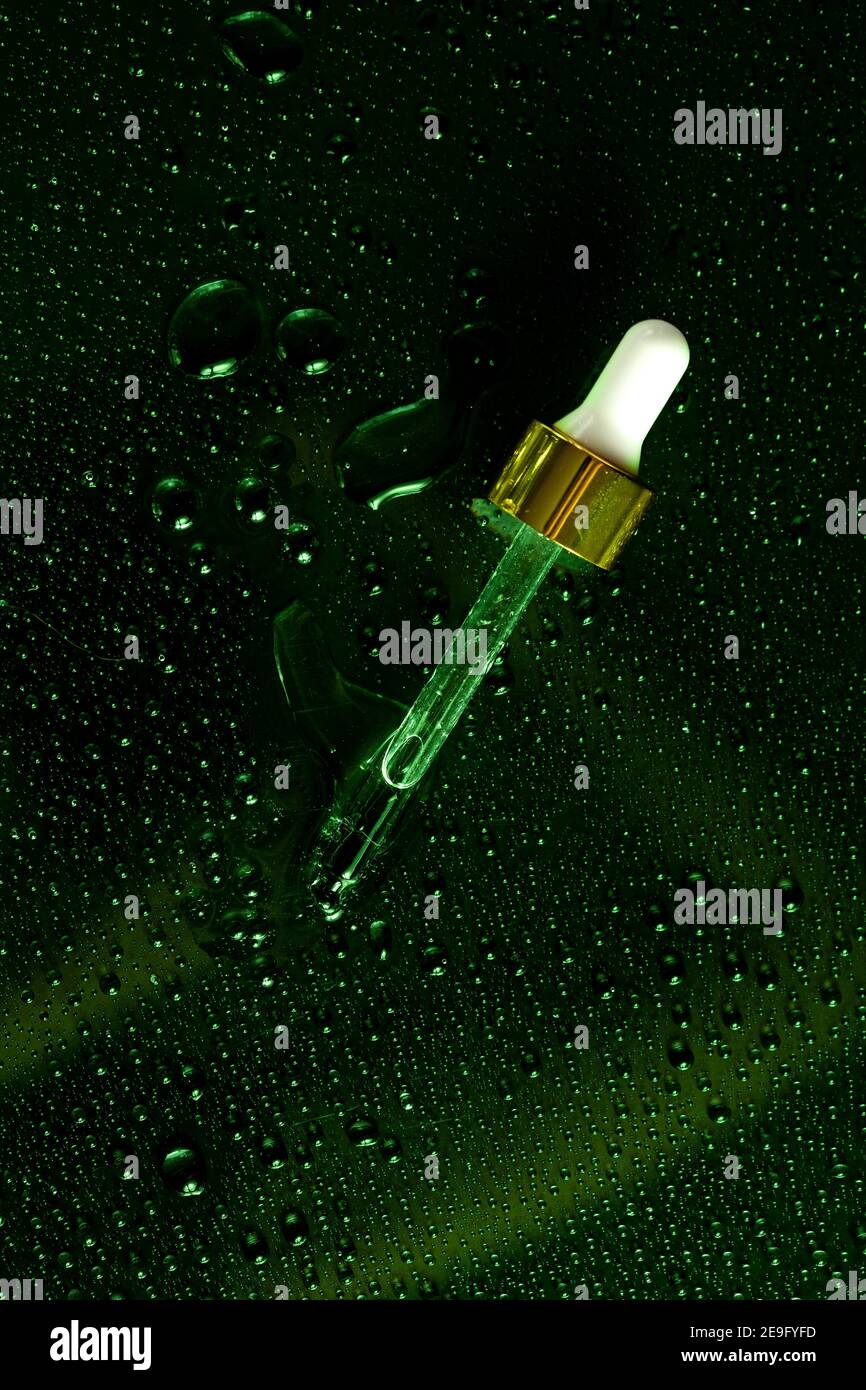 Green leaf with medicine dropper and water splashes. Cbd and plant ...