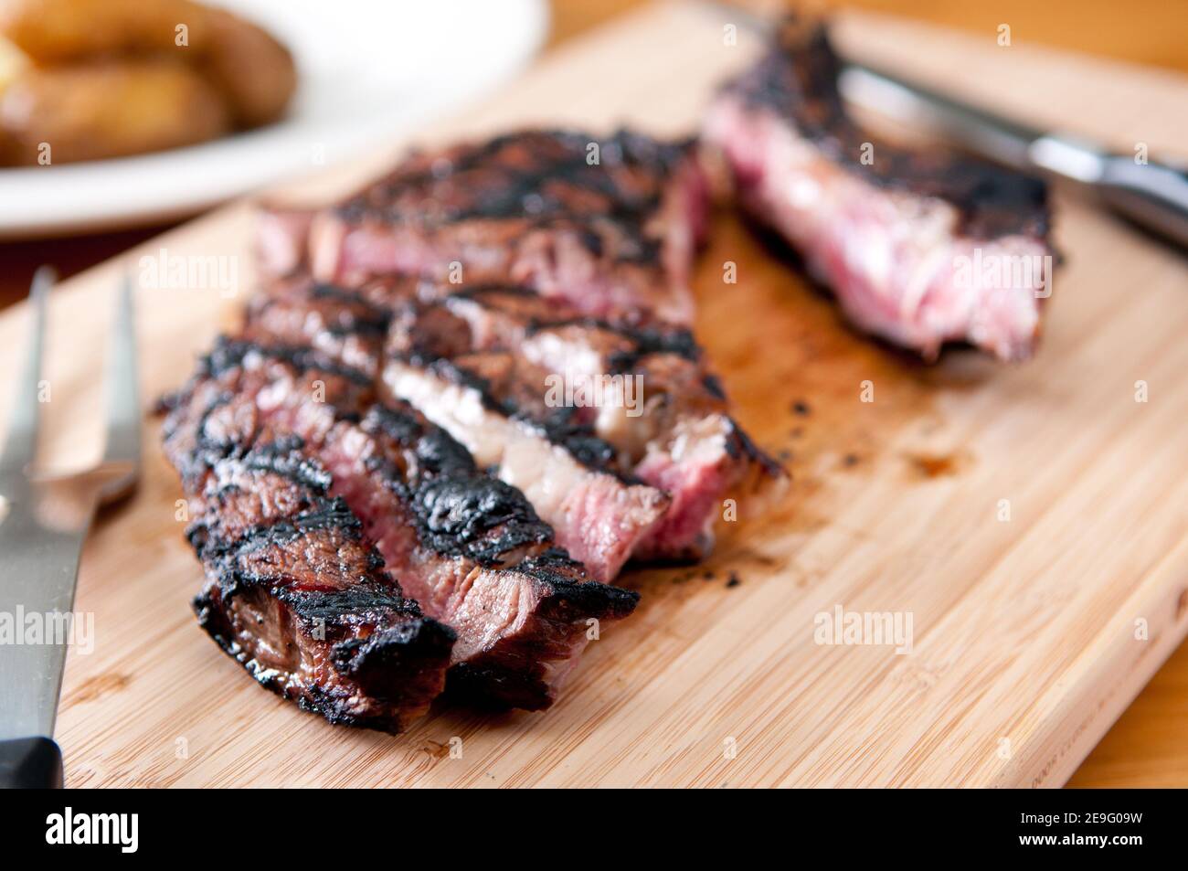 rare rib steak sliced Stock Photo - Alamy