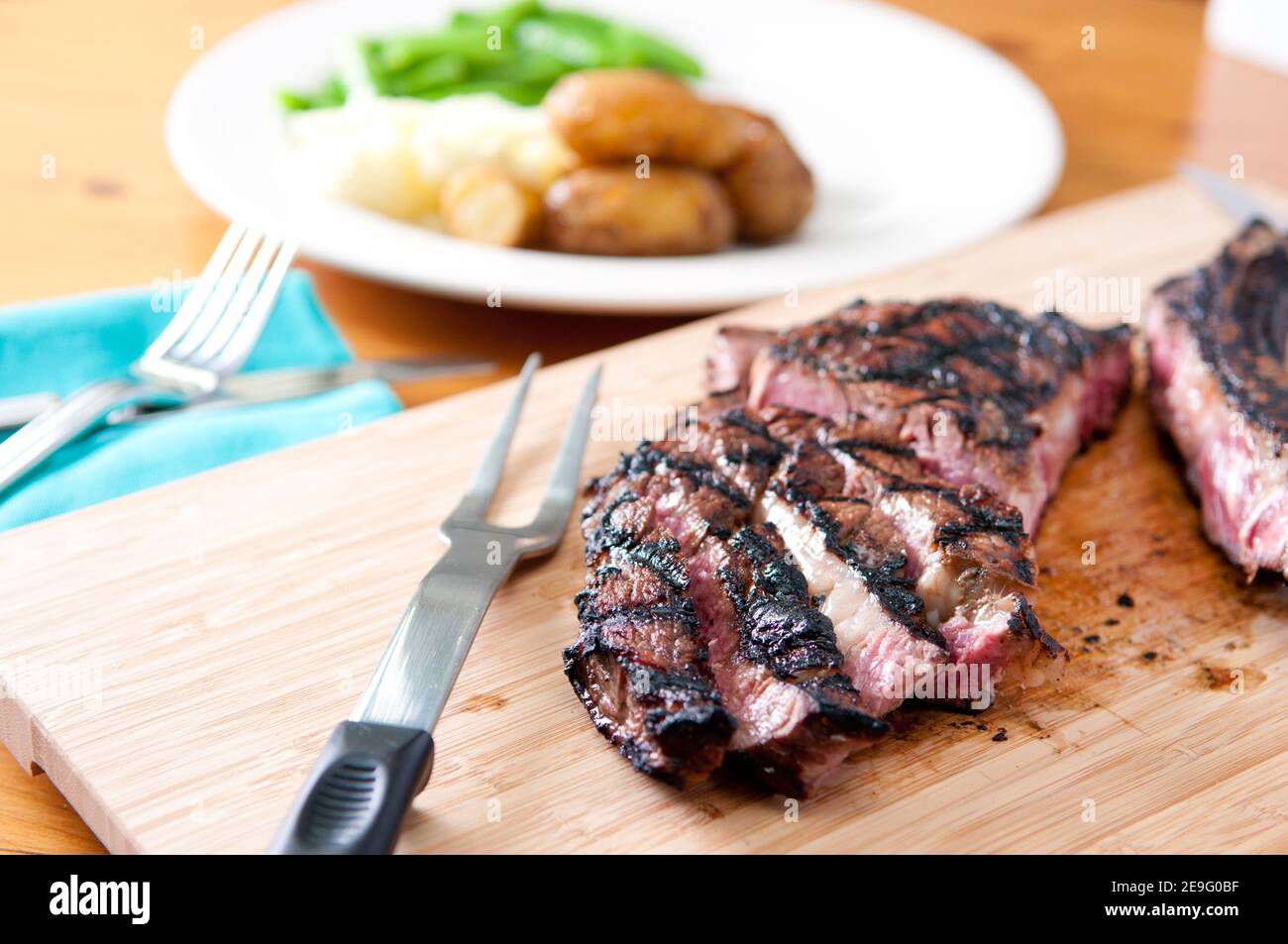 rare rib steak sliced for serving Stock Photo - Alamy