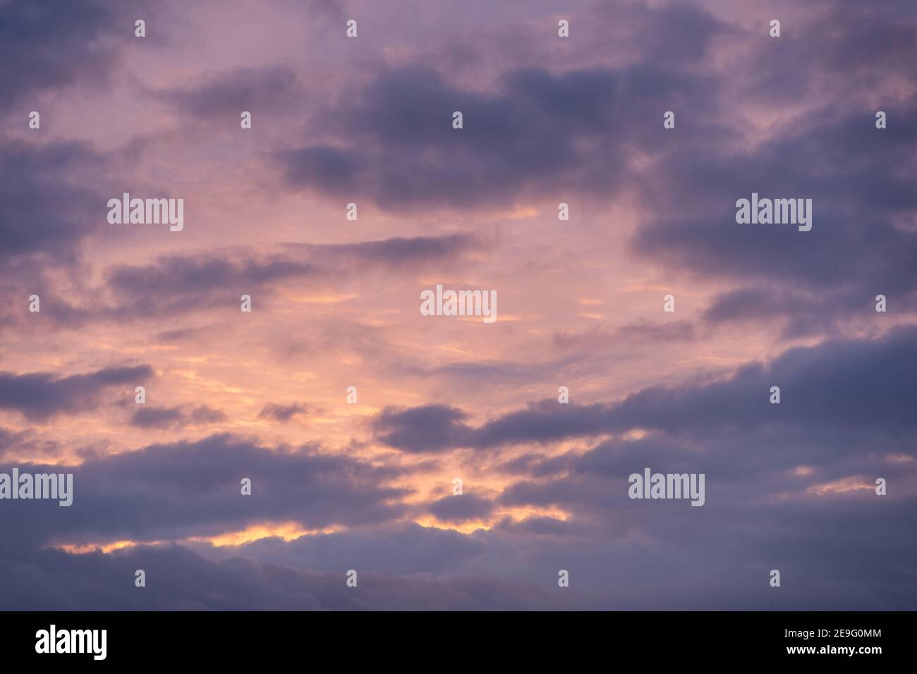 Colorful sunset after a thunder storm. Beautiful sky with clouds in ...