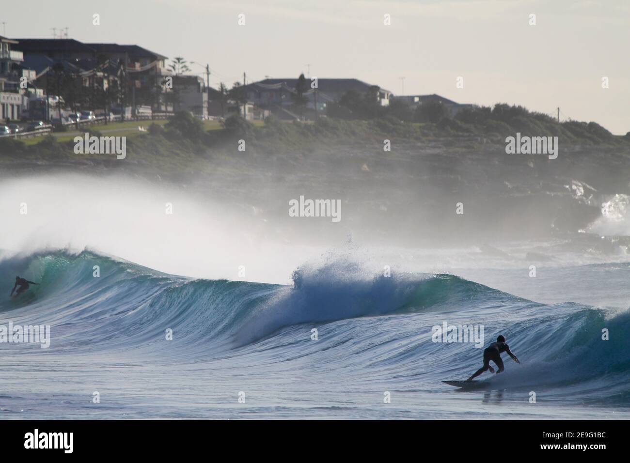 Two surfers facing each other Stock Photo - Alamy