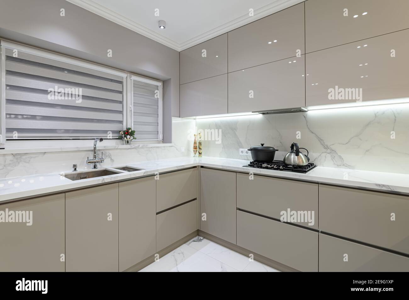 Luxury white modern marble kitchen in studio space Stock Photo - Alamy