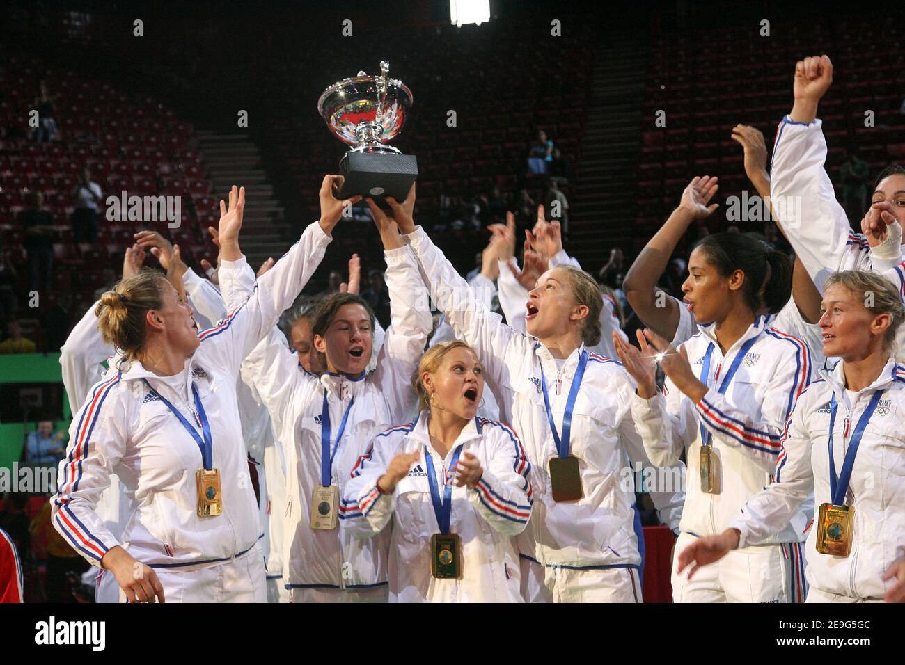 France's team celebrates after winning the extra-lightweight category ...