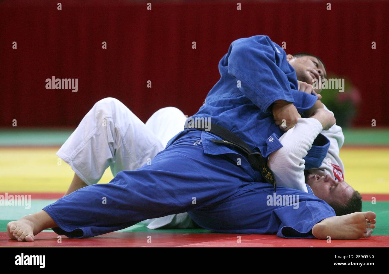 France's Matthieu Bataille competes with Japan's Yohei Takai during the ...