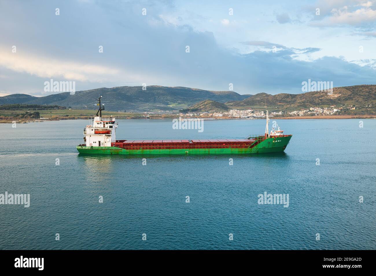 VOLOS, GREECE - Jan 30, 2021: merchant ship with the help of a tugboat ...
