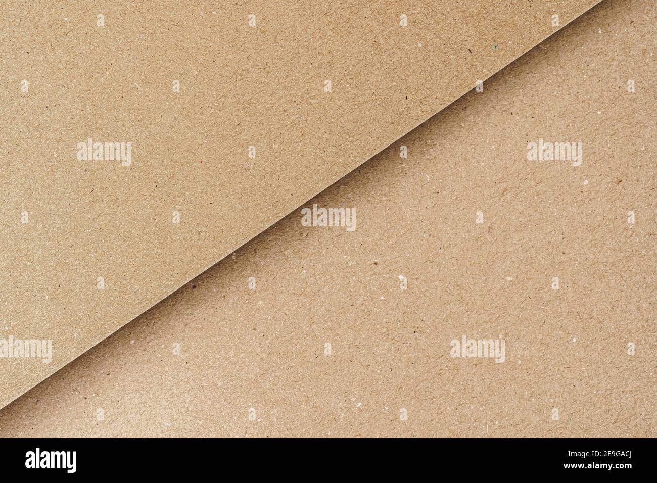 Brown recycled carton paper sheets close up Stock Photo - Alamy