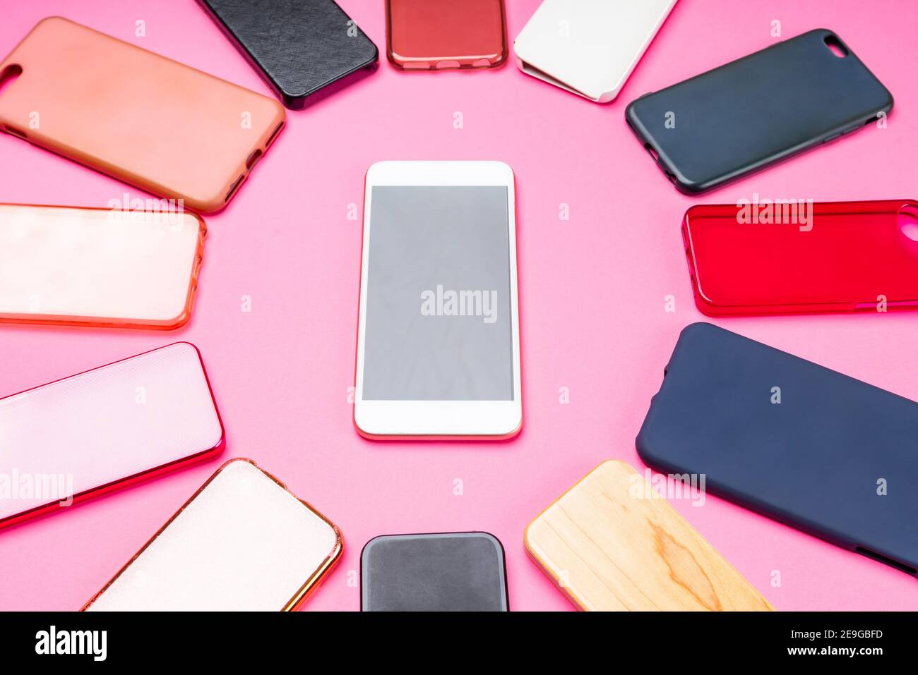 Choice of multicolored plastic back covers for mobile phones on pink ...
