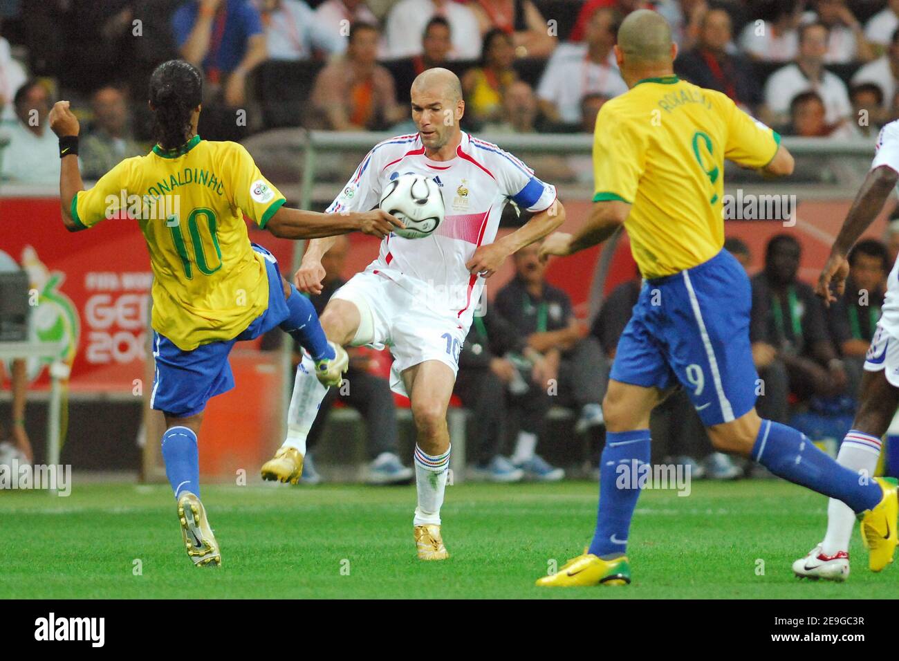 Brazil's Ronaldinho and France's Zinedine Zidane battle for the ball ...