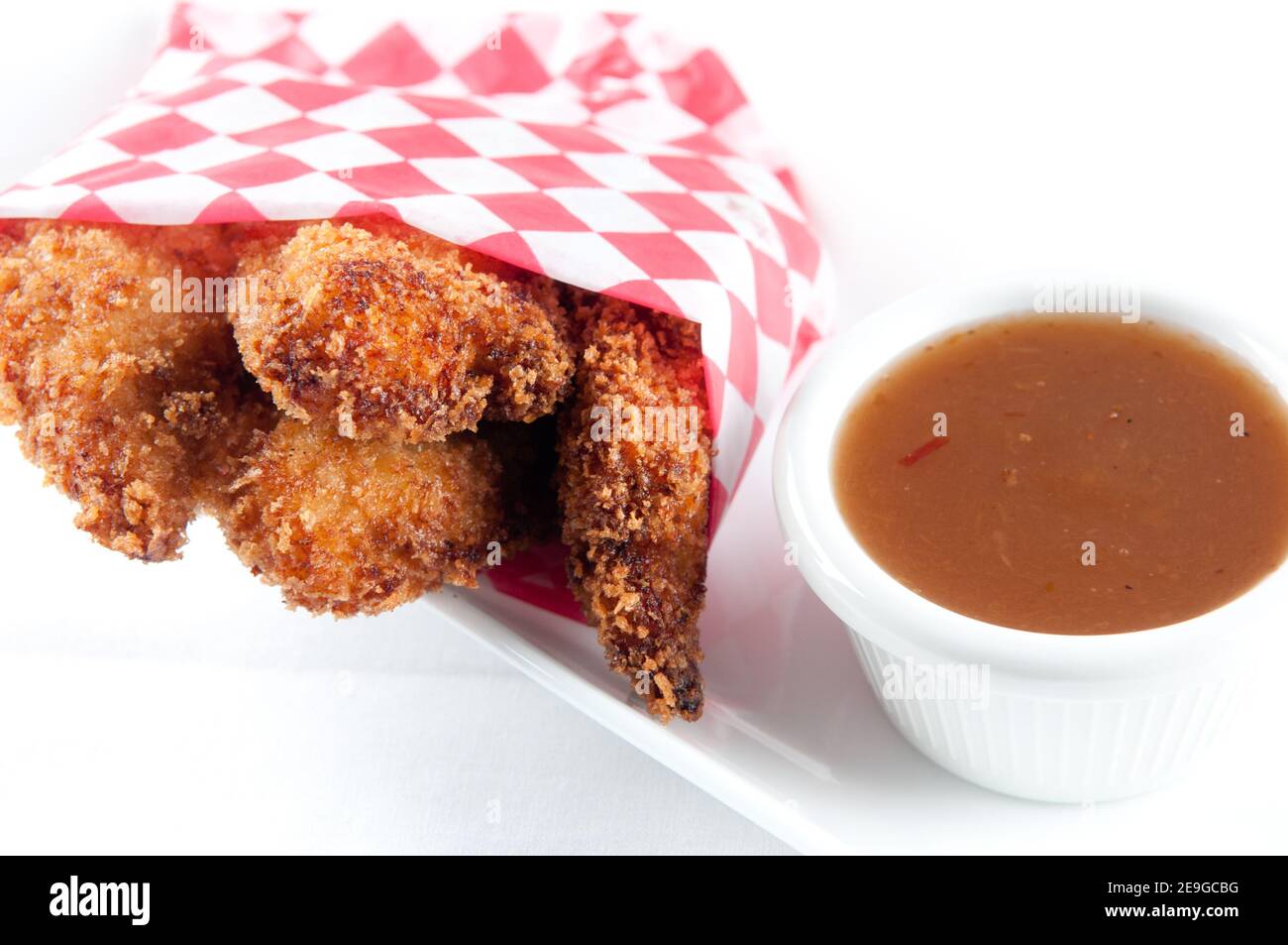 chicken tenders in an envelope with plum sauce Stock Photo - Alamy