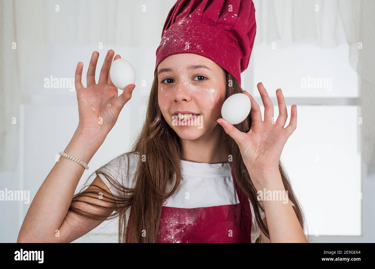 So tasty. teen girl chef wearing uniform. child study how to cook by ...