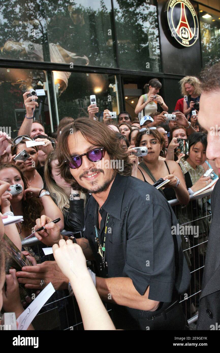 Cast member Johnny Depp signs autographs prior to the French premiere ...