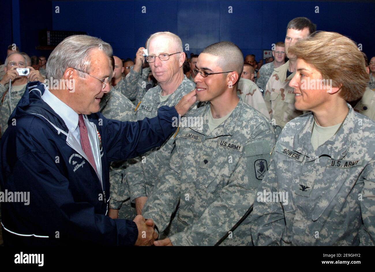 U.S. Defense Secretary Donald H. Rumsfeld shakes a soldier's hand ...