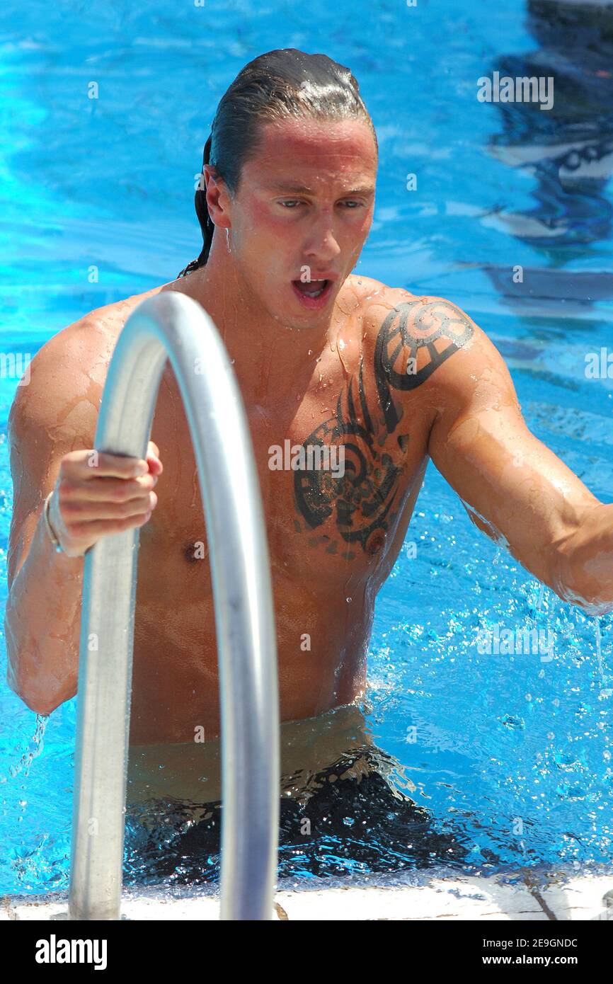France's Frederik Bousquet competes on men's 4x100 freestyle women ...