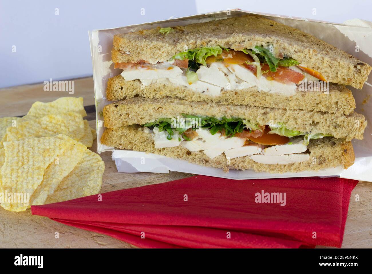 Chicken salad sandwiches for lunch pack with crisps Stock Photo - Alamy