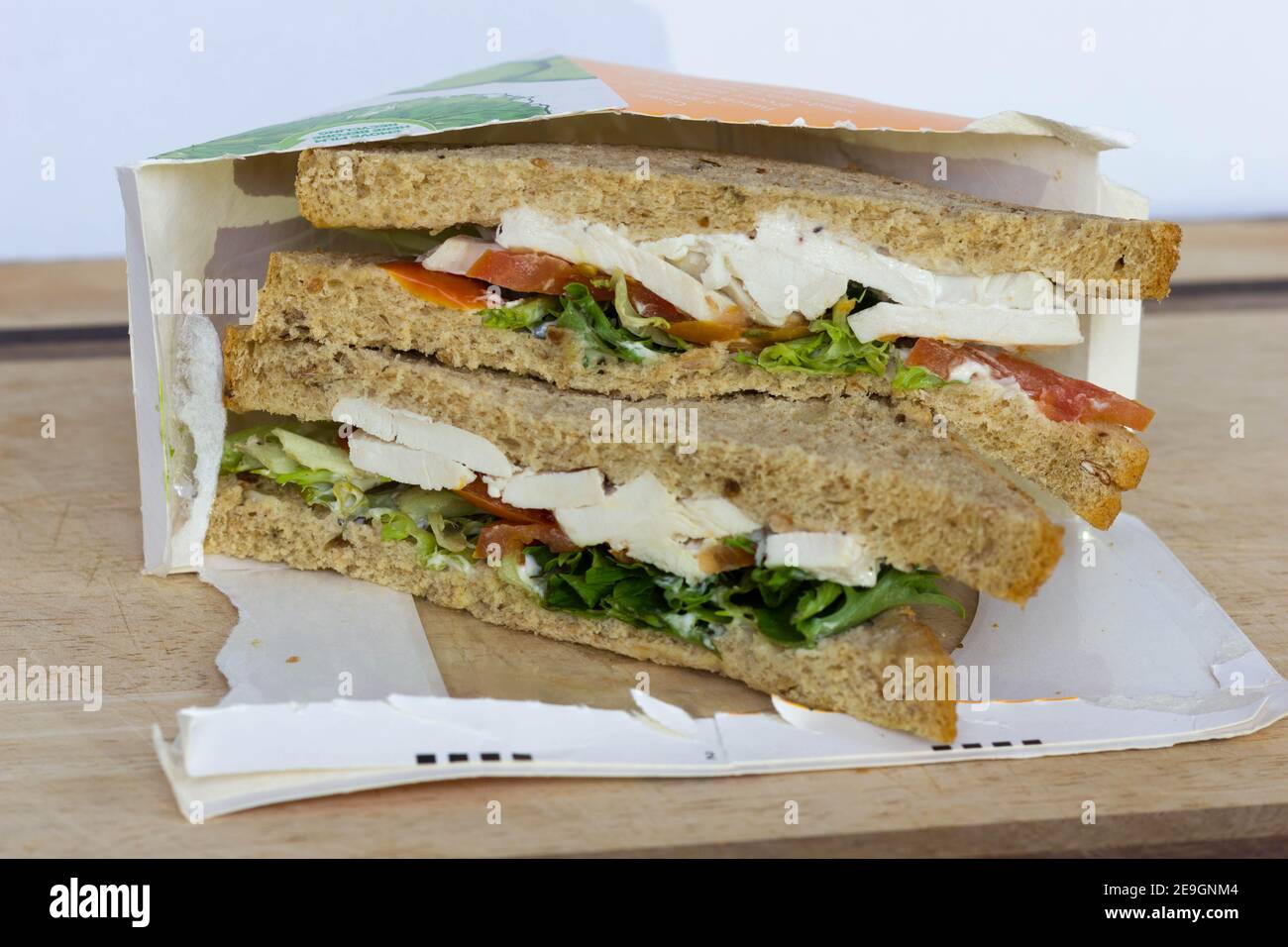 Chicken salad sandwiches for lunch pack with crisps Stock Photo - Alamy