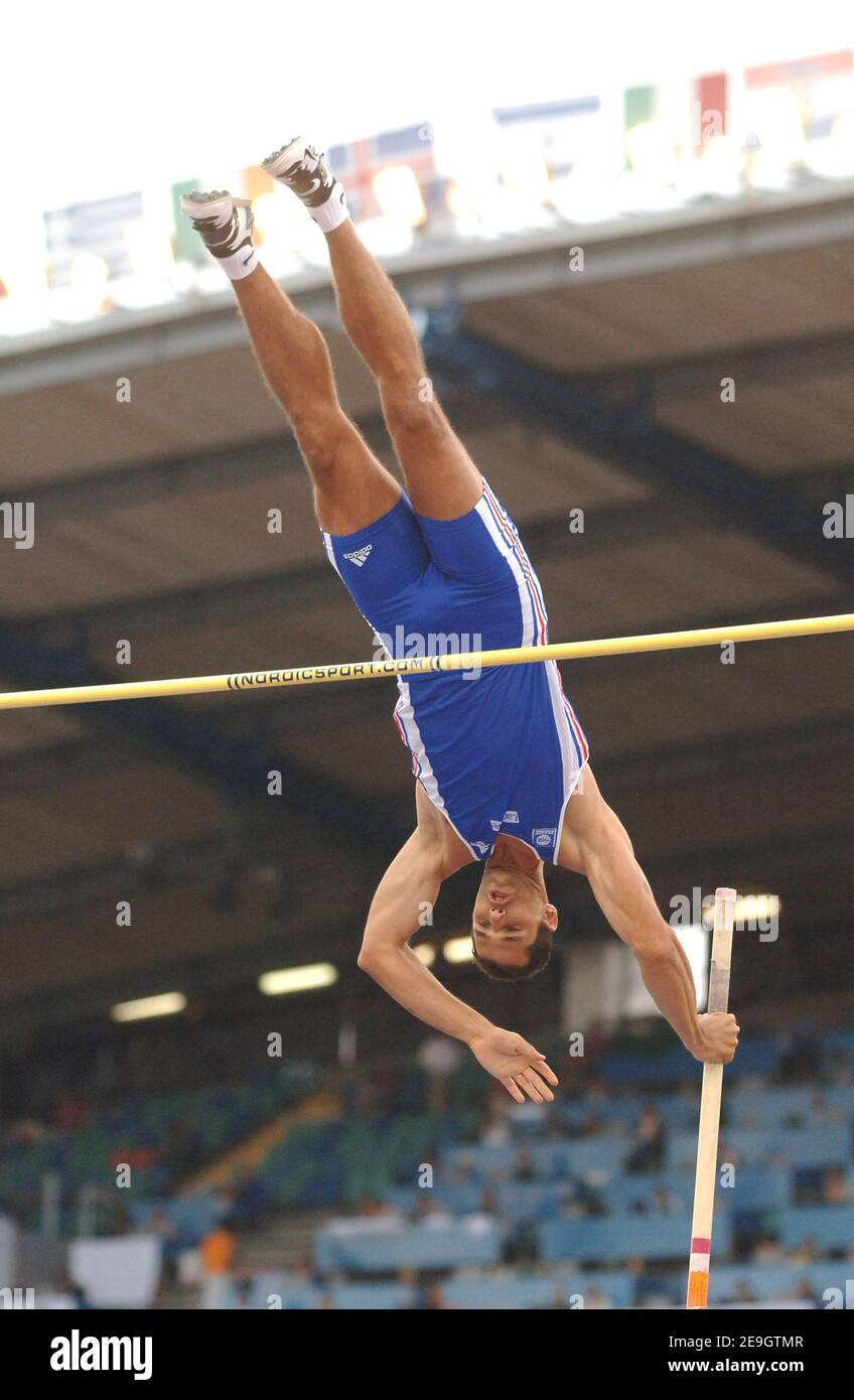France's Romain Mesnil competes on men's pole vault qualification at ...