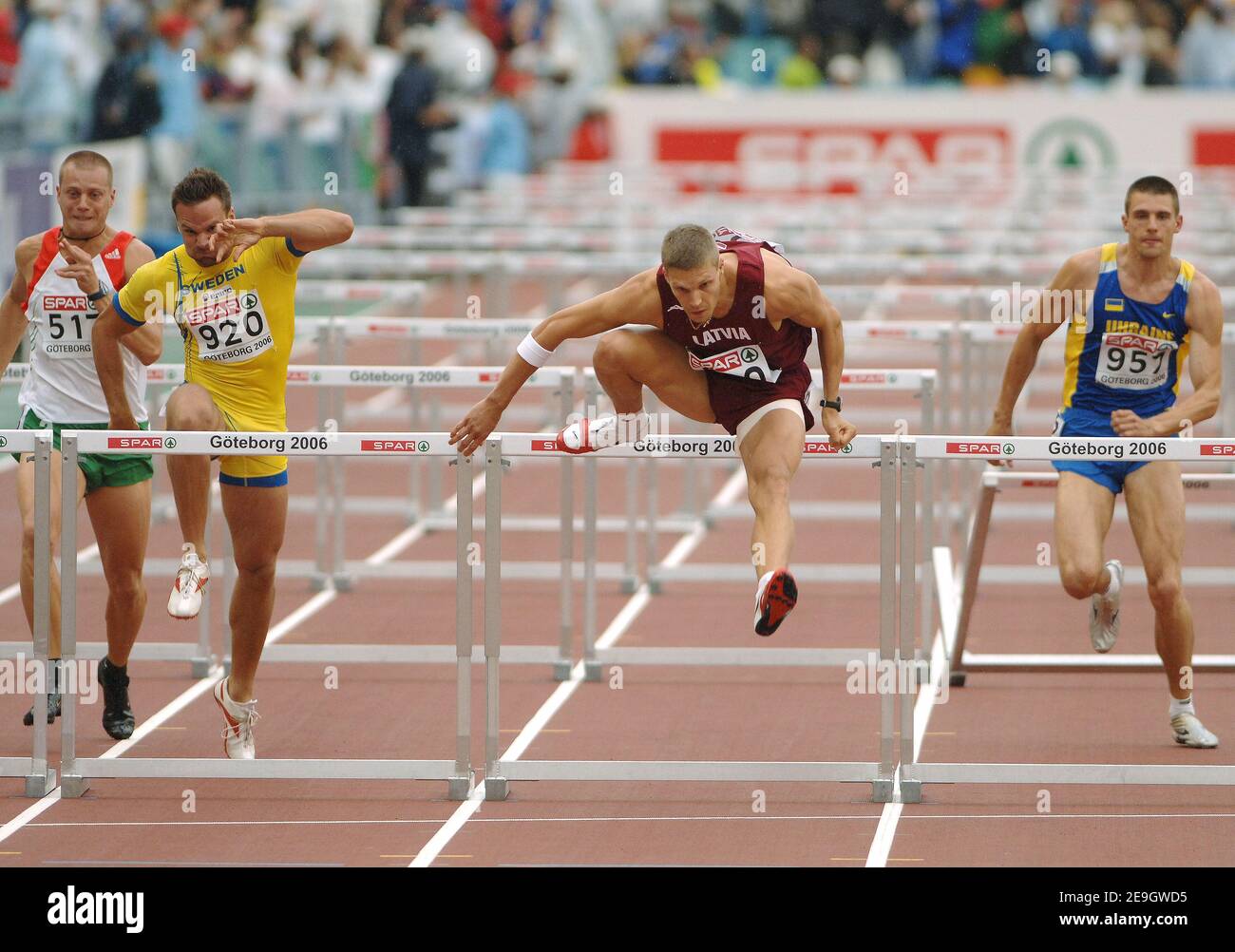 Latvia's Stanislav Olijar (C) performs next to Sweden's Robert Kronberg ...