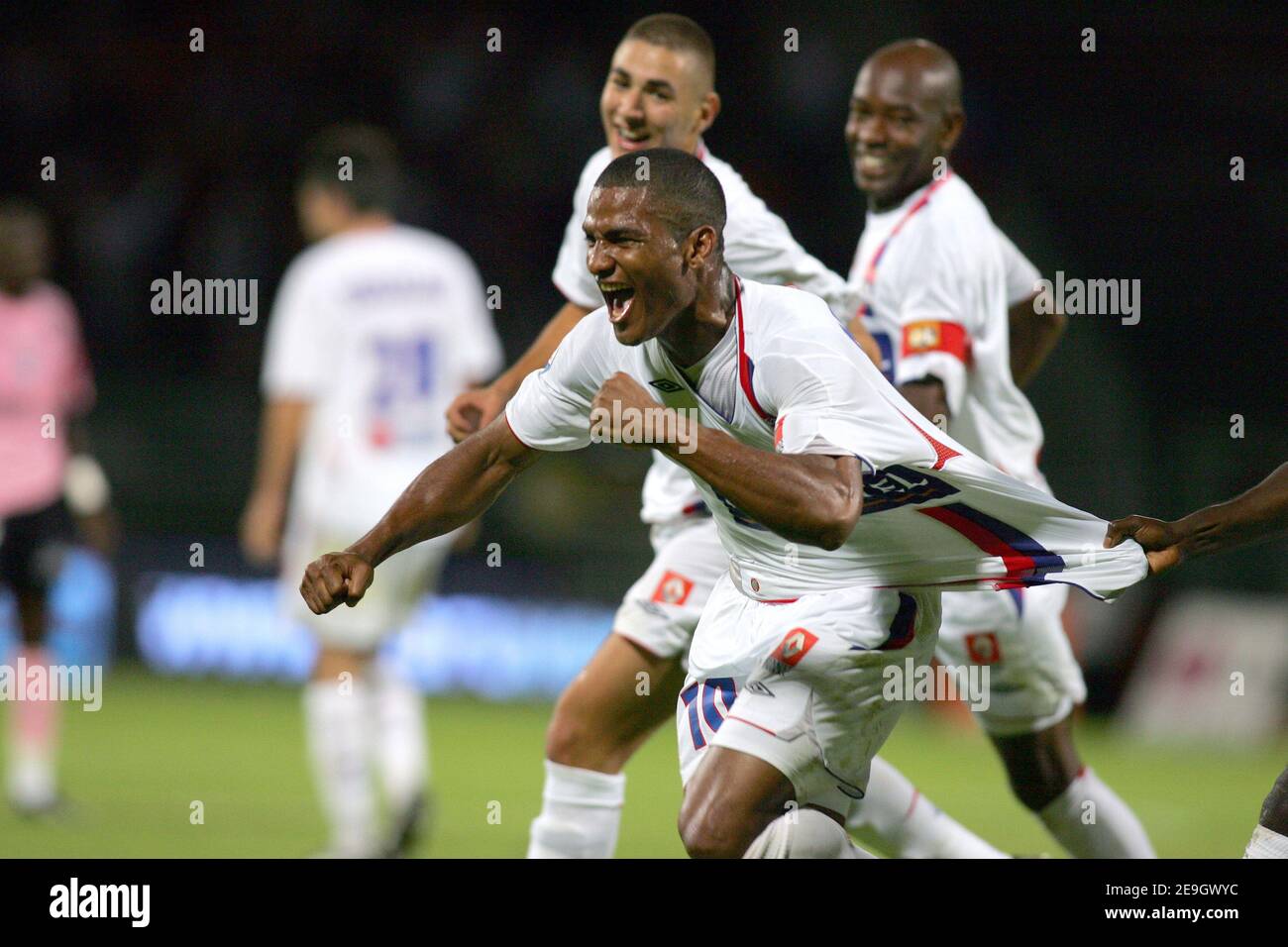 OL's Florent Malouda celebrates with teamates his goal during the ...