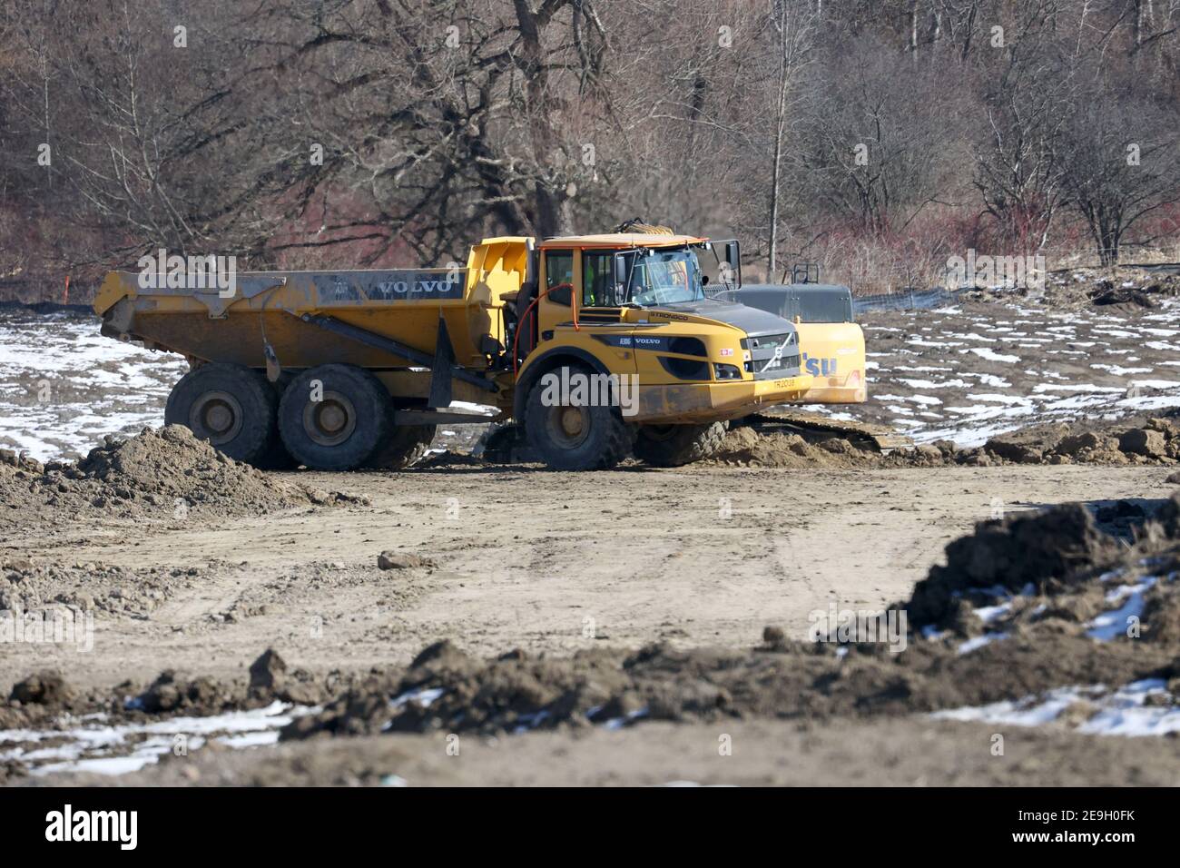 Winter Construction project moving earth Stock Photo - Alamy