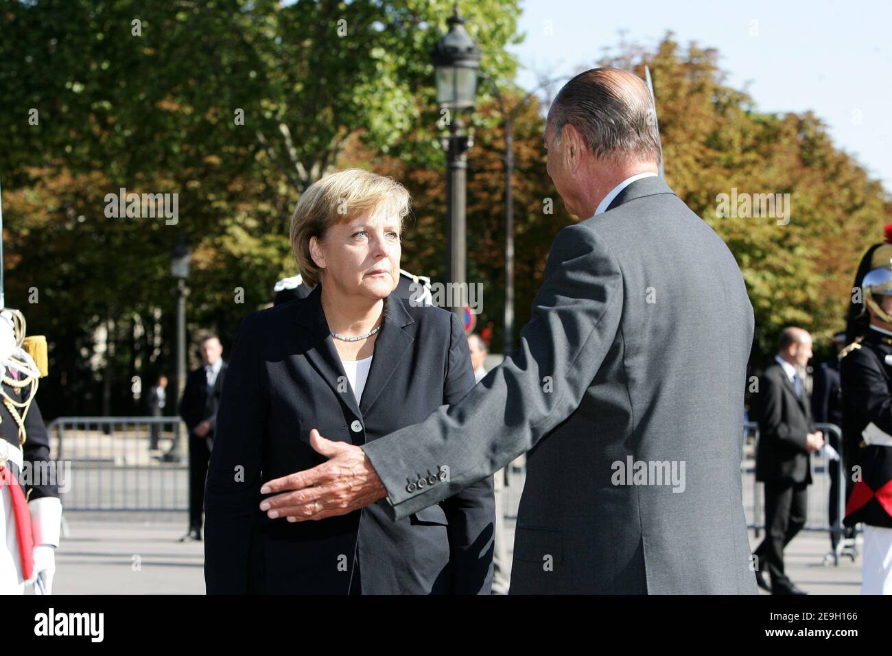 German Chancellor Angela Merkel and French President Jacques Chirac lay ...