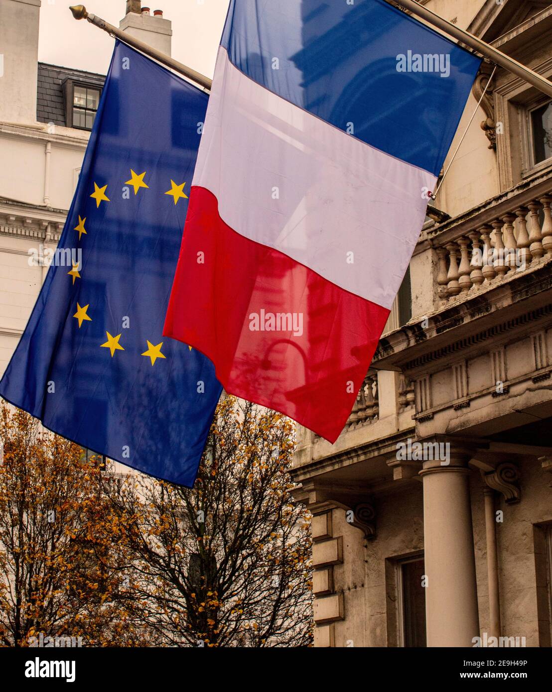 The flags of France and the European Union hanging outside the French ...