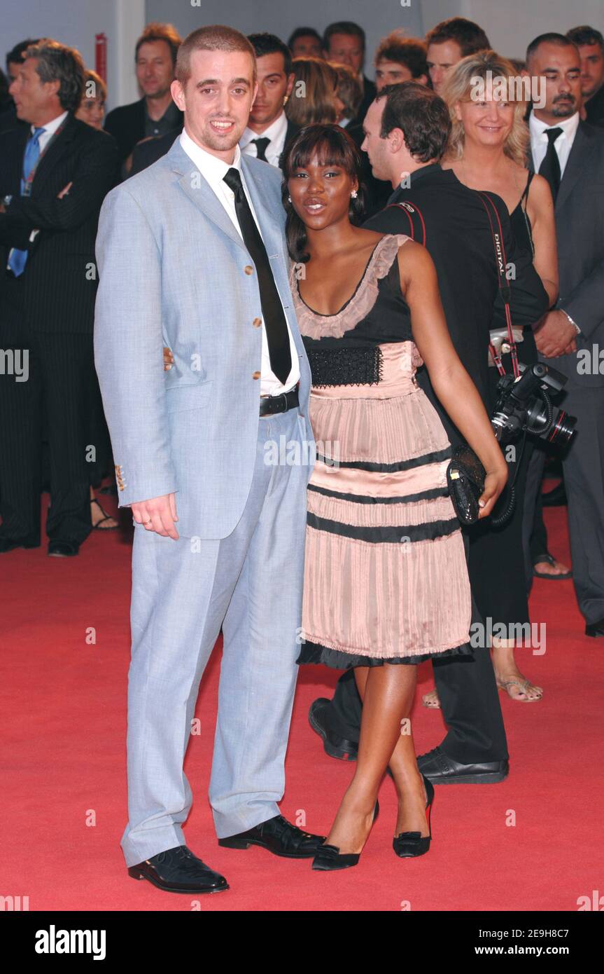 Cast member Claire-Hope Ashitey and her boyfriend pose for pictures as ...