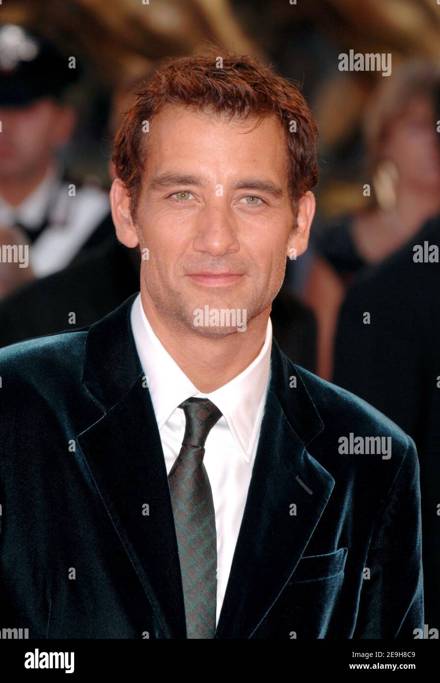 Cast member Clive Owen poses for pictures as he arrives to the premiere ...