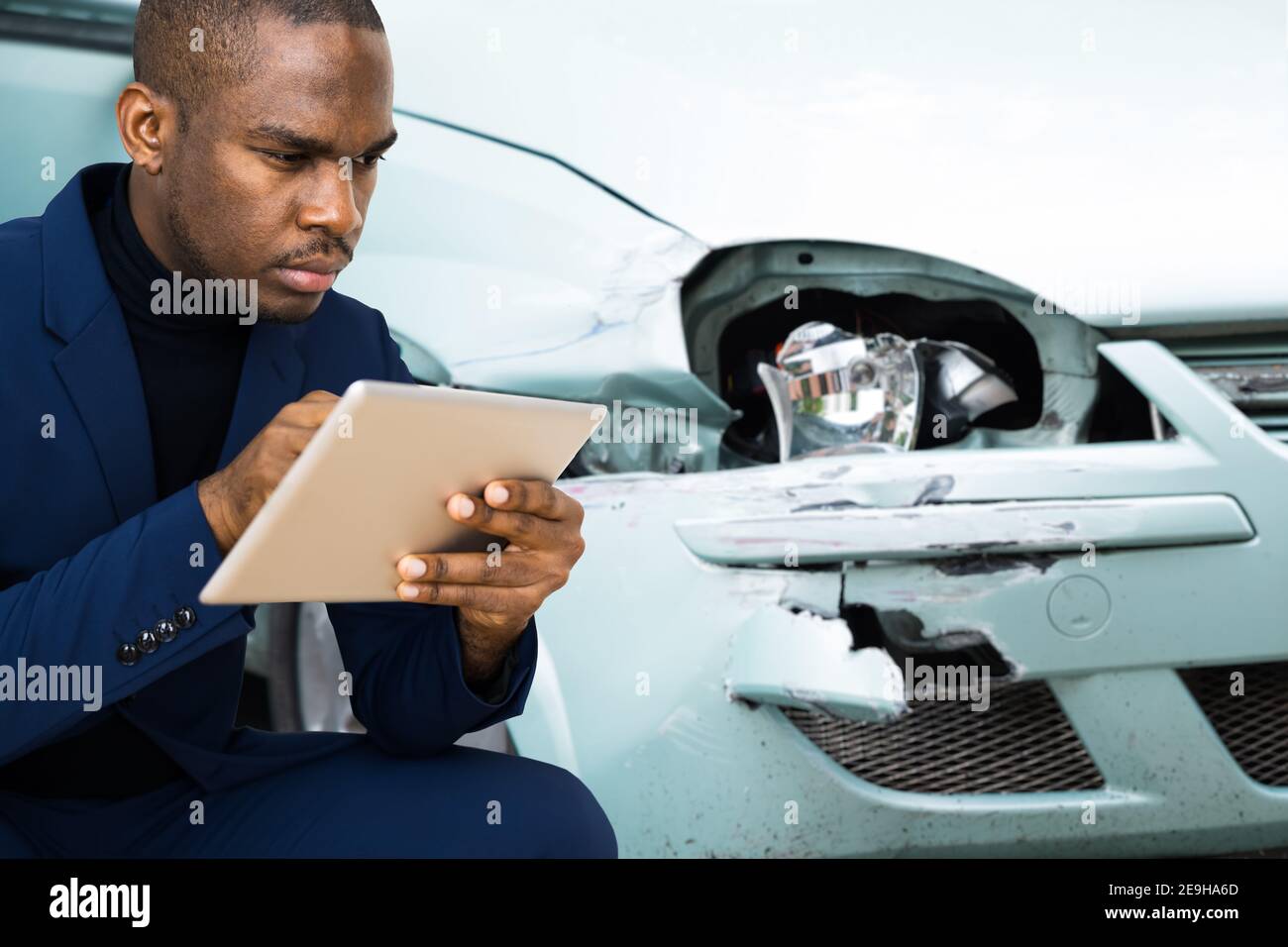 African American Car Insurance Agent Inspecting Accident Claim Stock ...