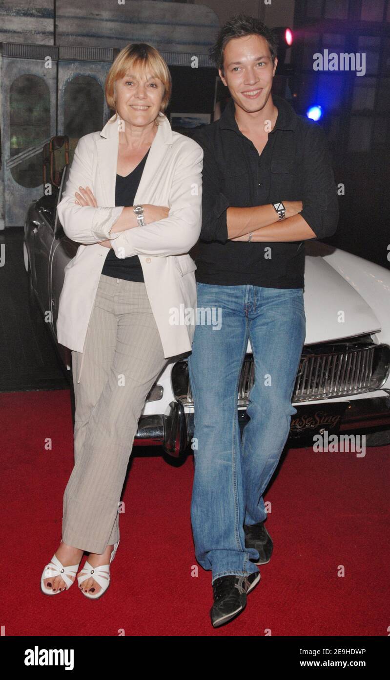 Marie-Laure Augry and her son Benoit pose together as they arrive to ...
