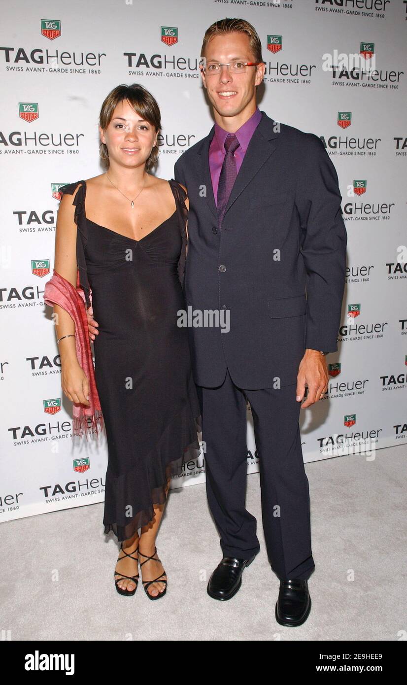 French race car driver Sebastien Bourdais attends with his wife Claire ...