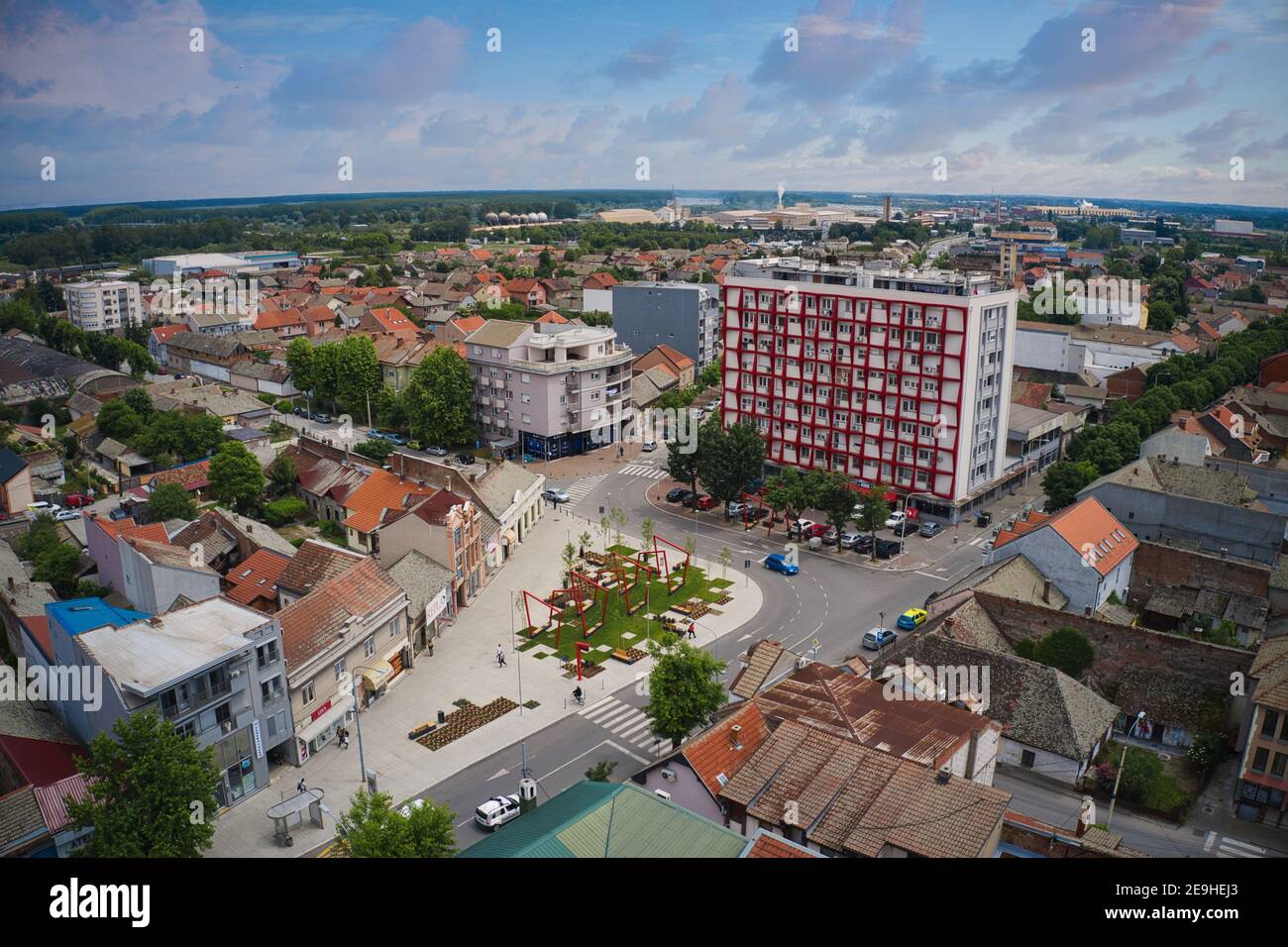 Landscape of a town covered in residential buildings under a cloudy sky ...