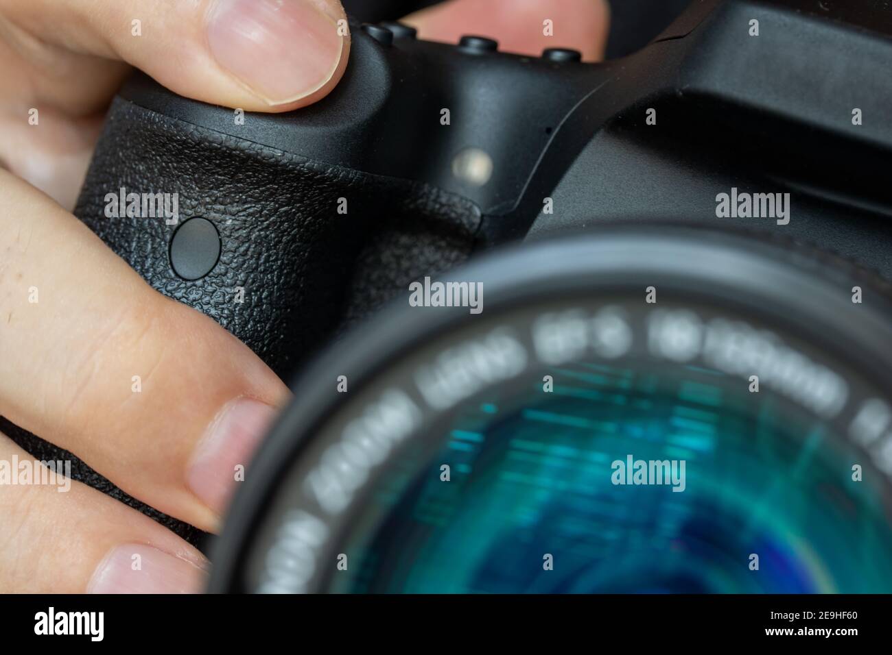 A pressing the shot button of a camera, close up. A take a picture ...