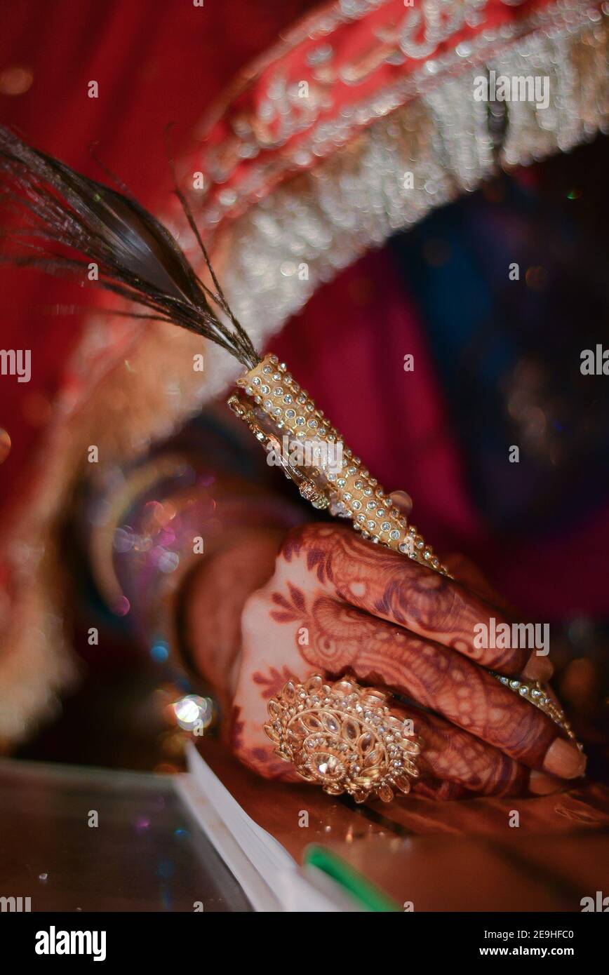 A bride signing her marriage contract (Nikkah Nama Stock Photo - Alamy