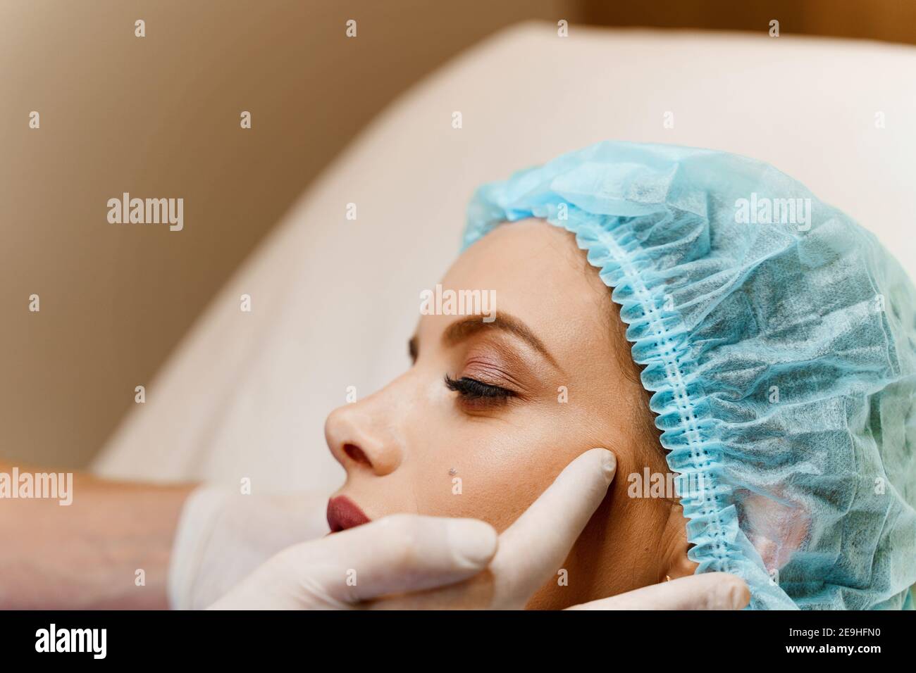 Facebuilding. Facial massage. Doctor touches girl face on consultation ...