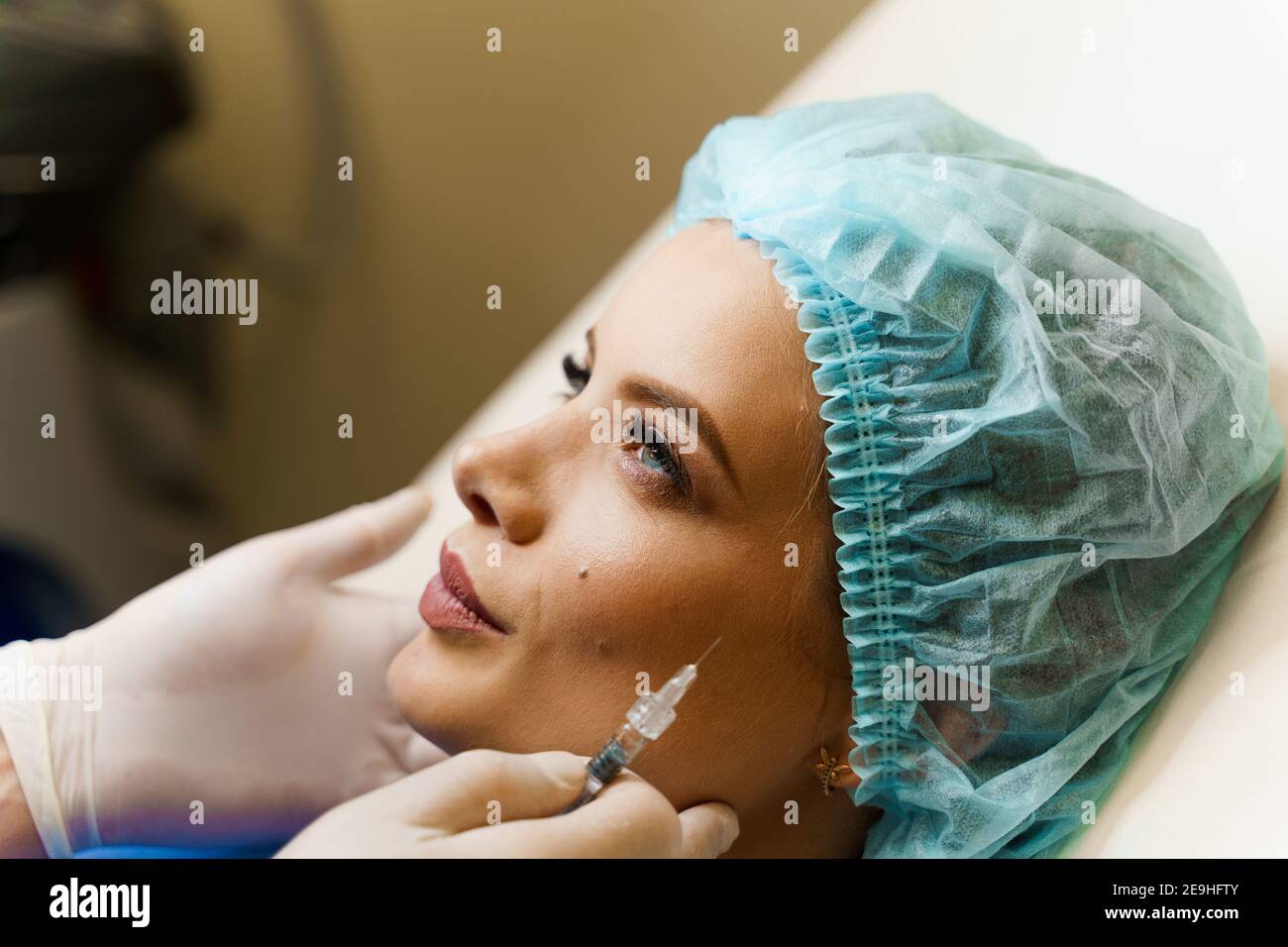 Injection in forehead contour plastic for correcting the volume and ...