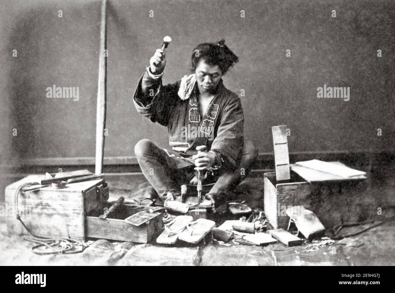 Late 19th century photograph - Shoemaker, cobbler, Japan, 1870's Stock ...