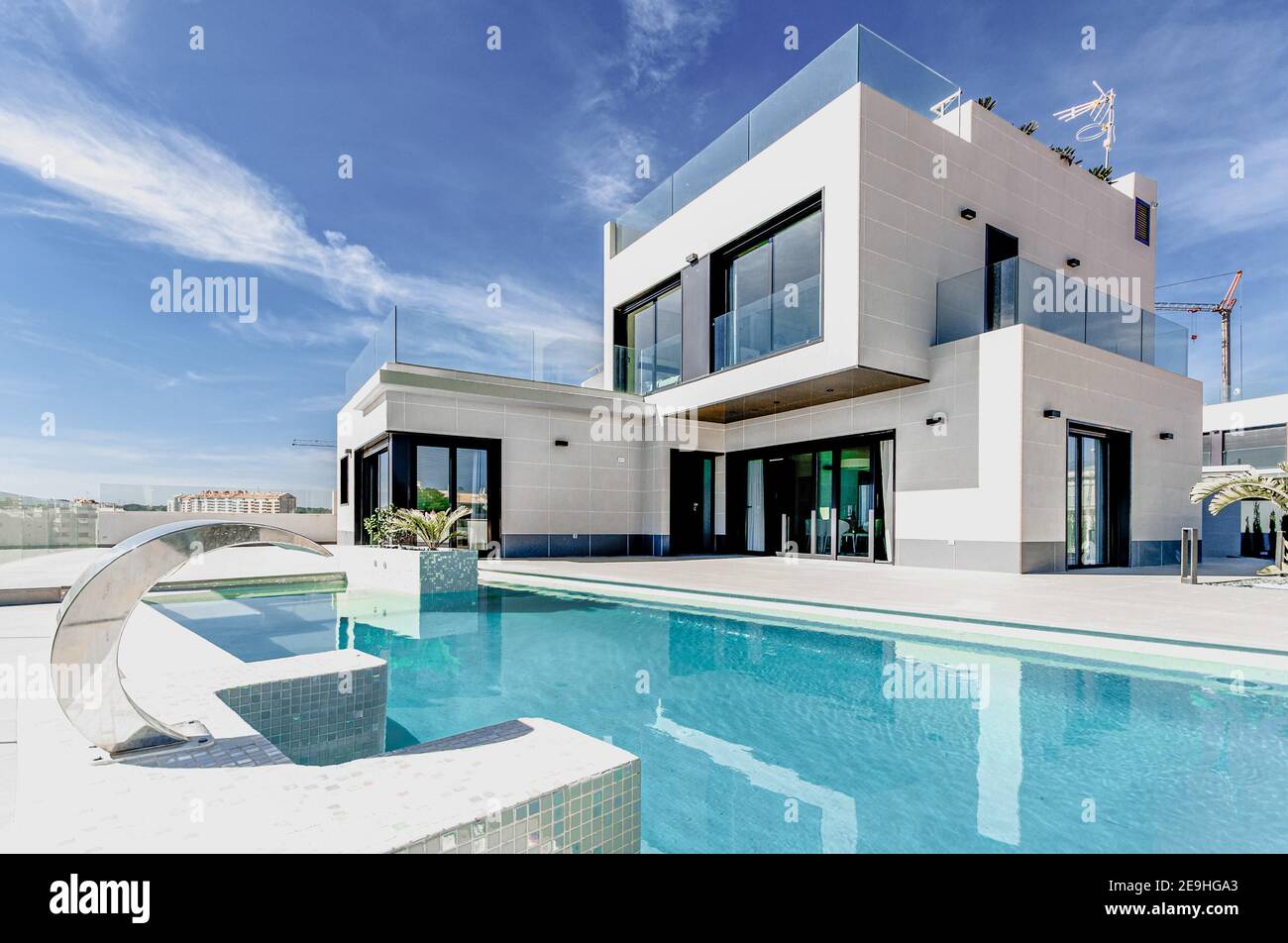 Beautiful, big and modern house with a pool under the cloudy sk Stock ...