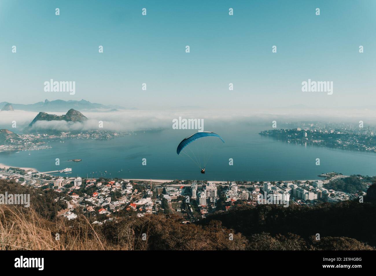 Angle view of the sea surrounded by buildings and hills with ...