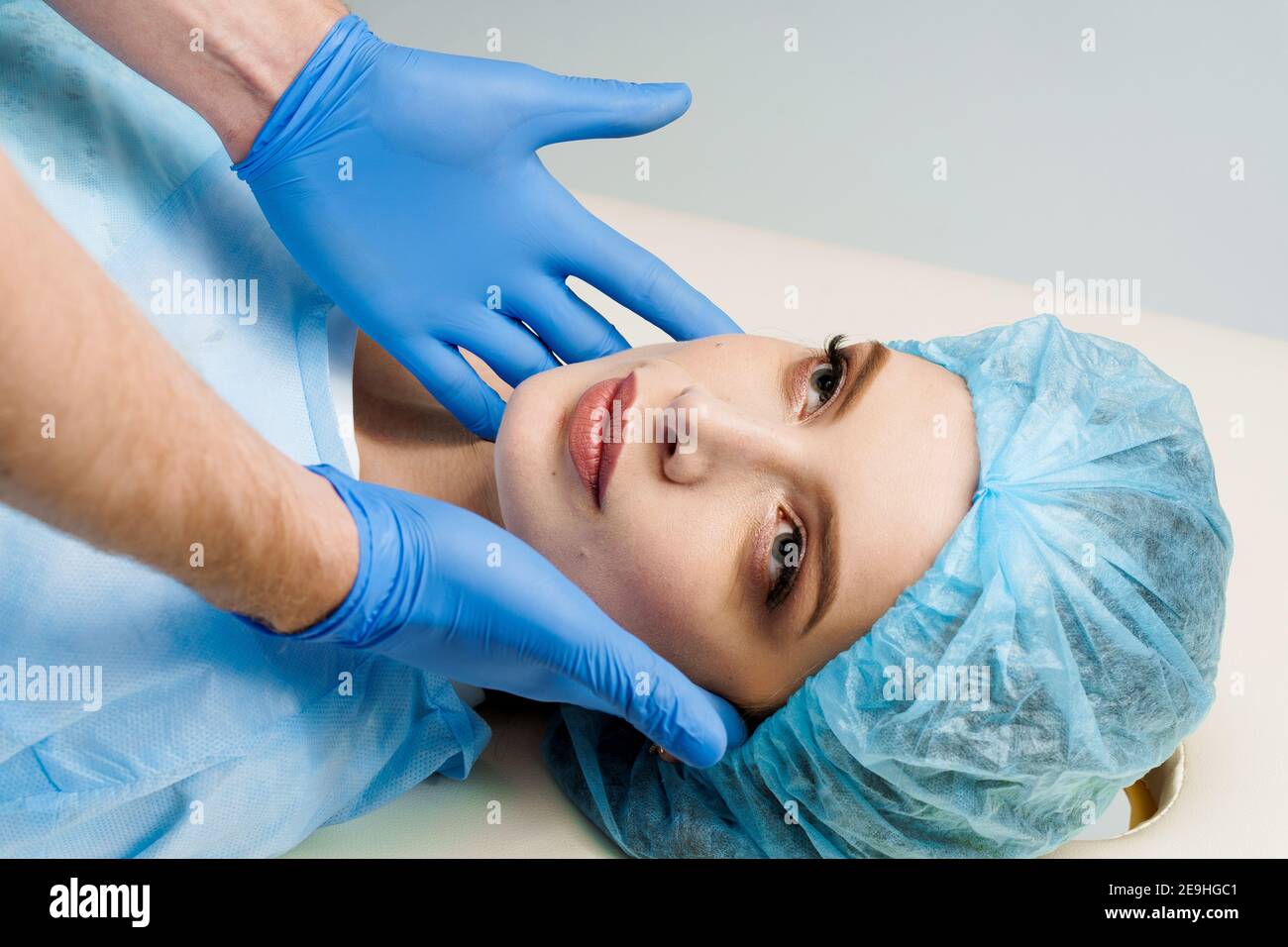 ?onsultation with plastic surgeon on white background. Cosmetic ...