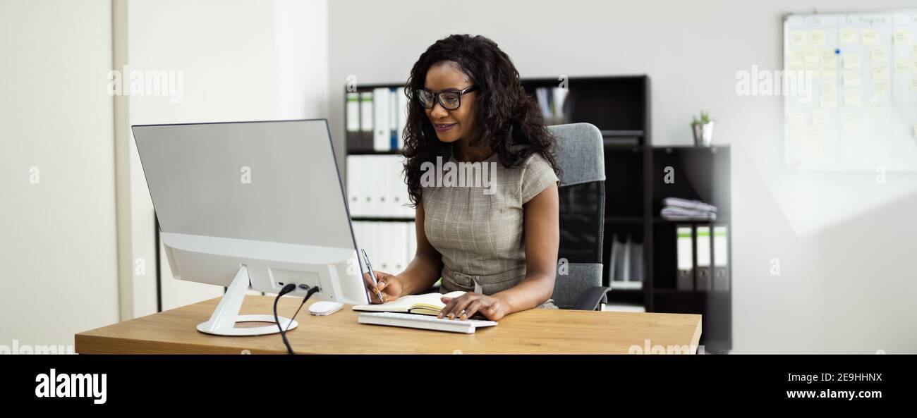 Happy African American Business Woman Using Computer Stock Photo - Alamy