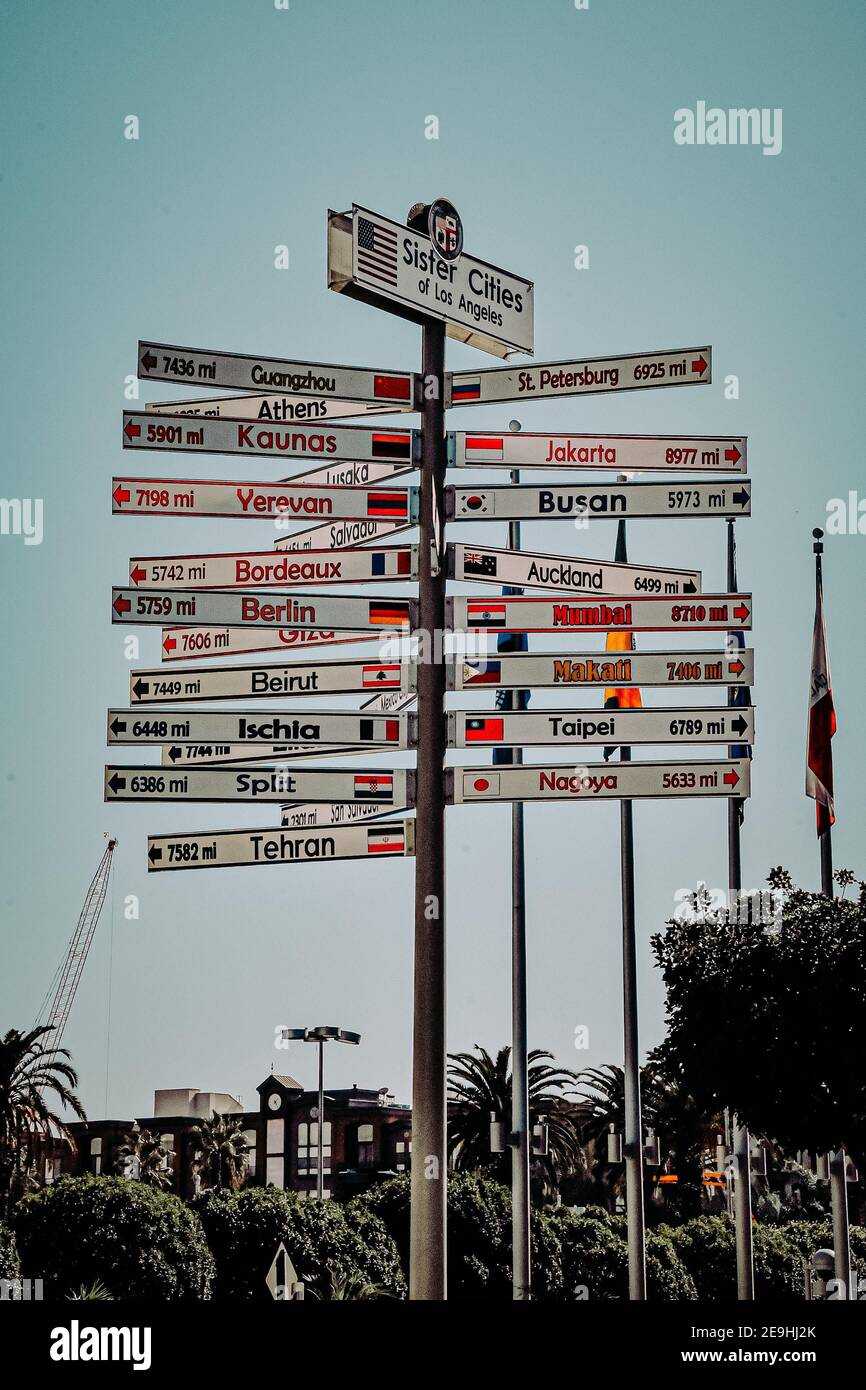 Vertical shot of the signposts of sister cities of Los Angeles under ...