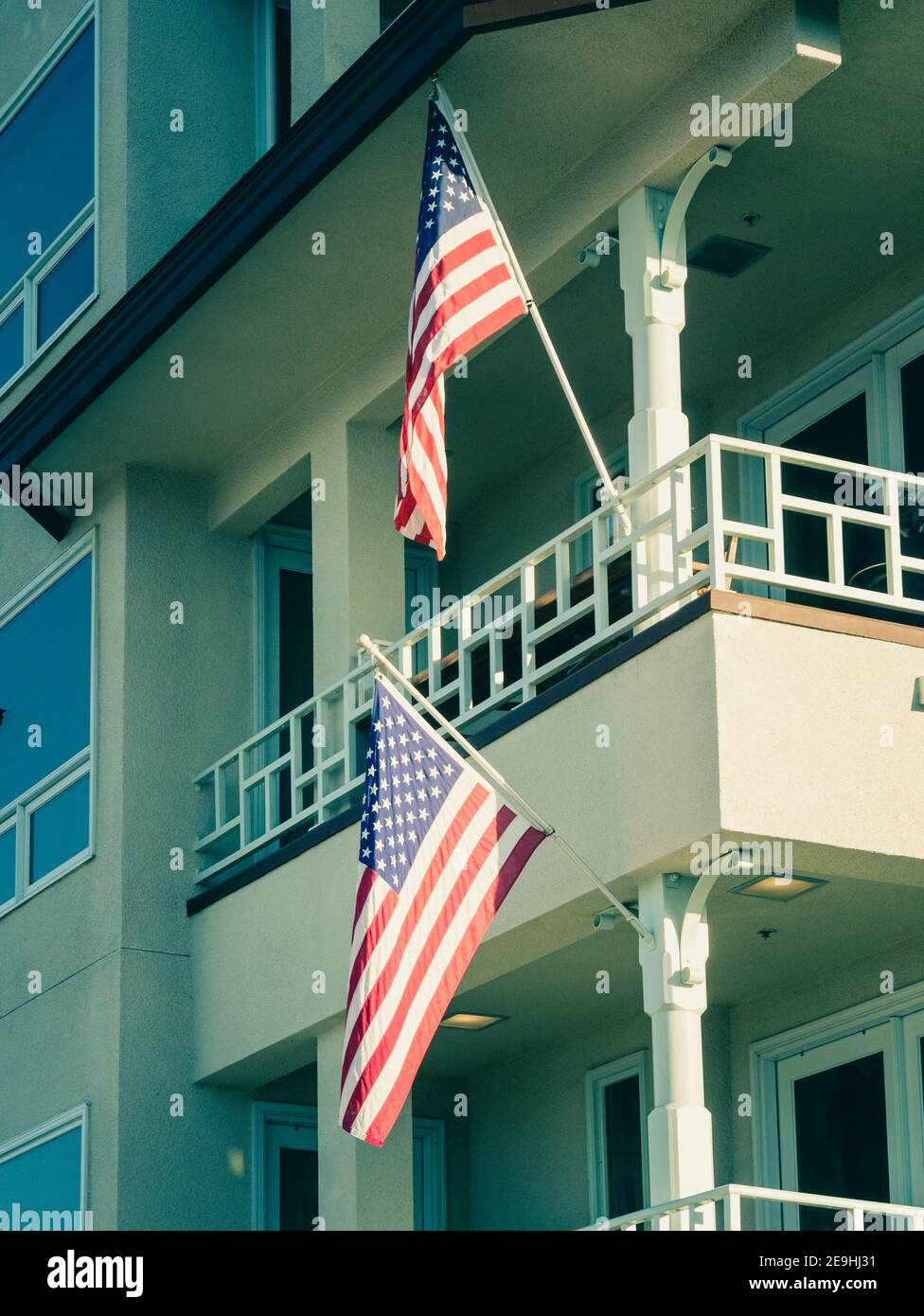 Vertical shot of balconies decorated with the American flags Stock ...