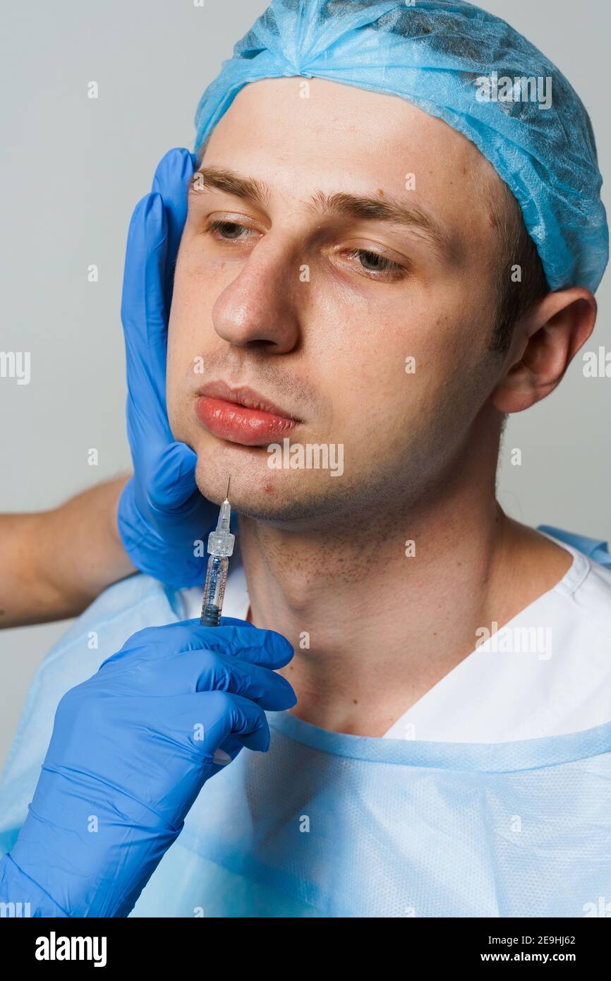 Lip augmentation for men. Girl student trying injection. Medical study ...