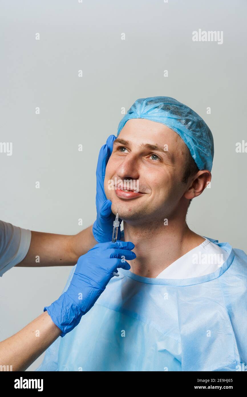 Lip augmentation for men. Girl student trying injection. Medical study ...